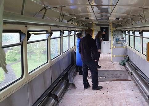 Hitachi Rail engineers transform disused train carriage into library ...